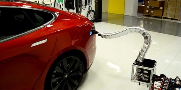 Charged EVs | Tesla reveals prototype of snakelike automatic charger ...